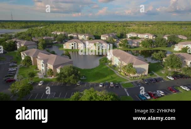 Gated residential community with condo homes in Florida with lake water ...