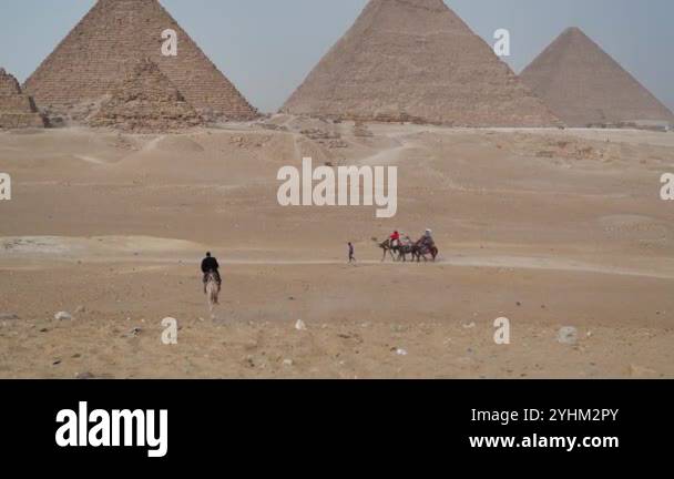 EGYPT, GIZA, CAIRO, DECEMBER 11, 2019: People on Giza pyramid complex ...