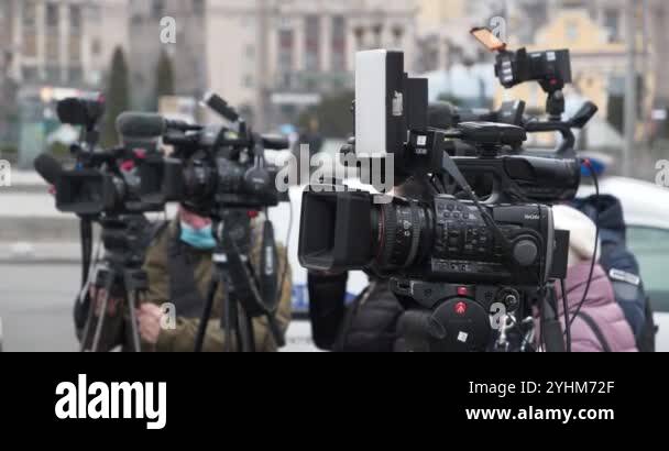 KYIV, UKRAINE, DECEMBER 22, 2020: Video operators with camcorders on ...