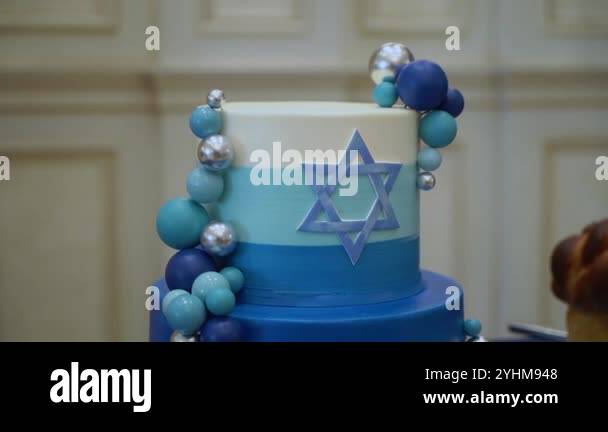 A beautifully crafted and designed blue cake that features the elegant ...
