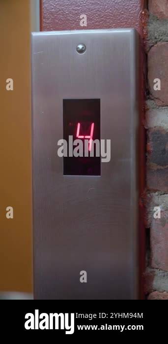 The elevators control panel shows its on the fourth floor, featuring a ...