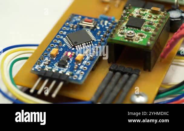 Electronics repair. Small electronic circuit with burning red LED light ...