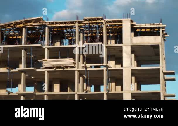 Unfinished construction of dwelling house. New reinforced concrete building under construction ...