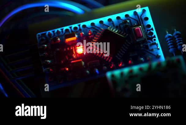 Electronic circuit with burning red LED light bulb in blinking ...