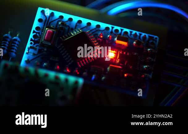 Electronics inspection. Electronic circuit with burning red LED light ...