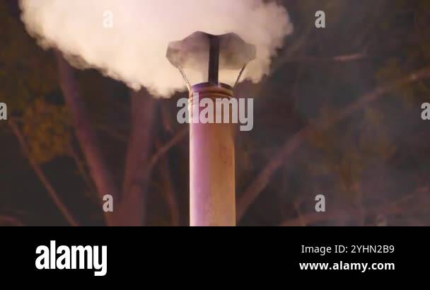 Smoking chimney. Stove pipe. Smoke and carbon dioxide emissions from chimney because of burning ...