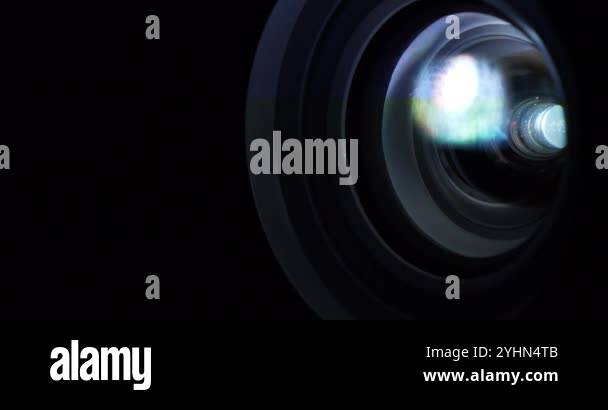 Cinema hall. Movie is shown through projector. Light of different colors passes through lenses ...