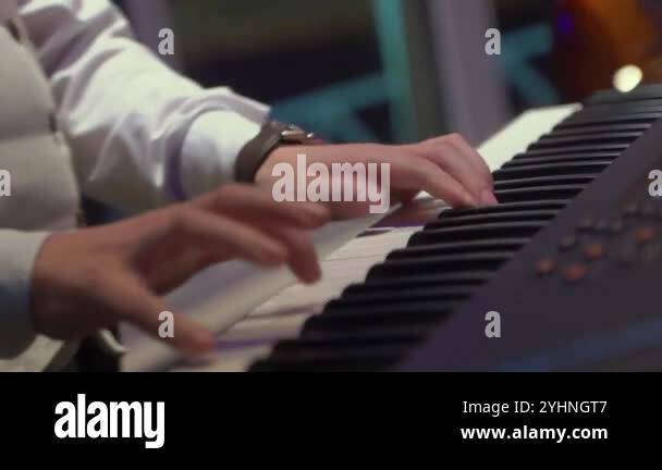Pianist plays music on a piano. Musician at a concert or repetition ...