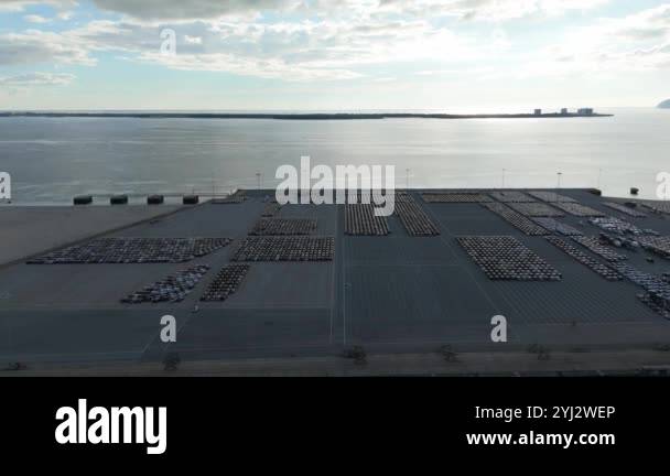 New Cars on Large Parking Lot in Half Empty Port Ready for Distribution ...