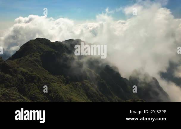 4K Time lapse, high view of misty weather and many clouds on mountain ...
