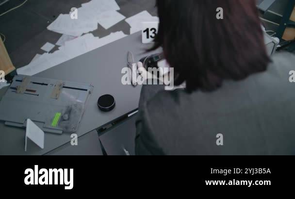 Robbery or murder case: Top view on female criminalist taking photos of ...
