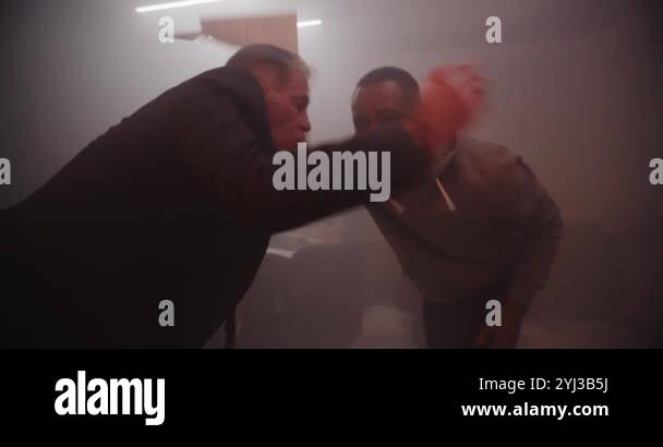 Tracking shot of multiethnic people in panic running out of burning ...