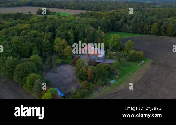 Traditional north german farm is nestled in the forest, photographed ...