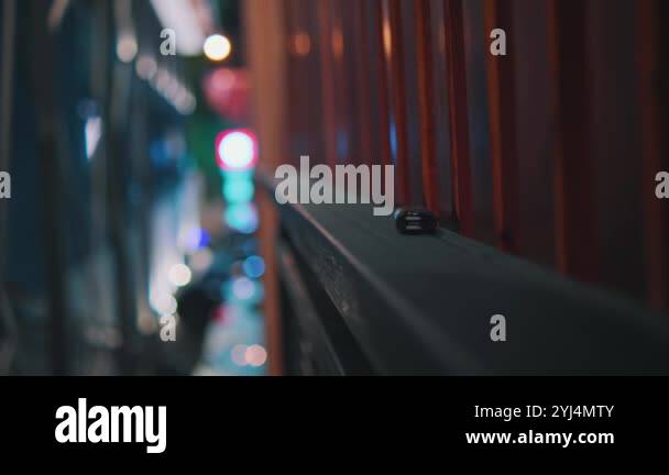 A vibrant night scene at a modern outdoor bar or restaurant. Colorful ...