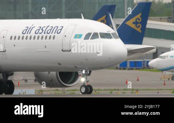 ALMATY, KAZAKHSTAN - MAY 11, 2024: Jet passenger plane Airbus A321, EI-KDF of Air Astana taxiing ...