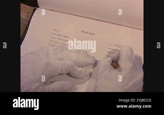 USA - 1960 - Uranium oxide pellets are transferred to a fuel tube at a ...