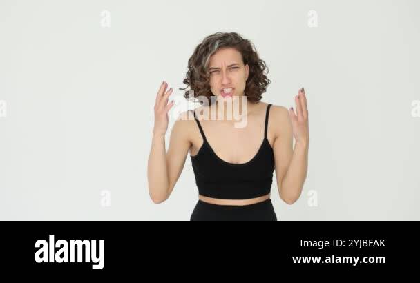 Woman reacts with anger and disappointment on white background. Angry ...