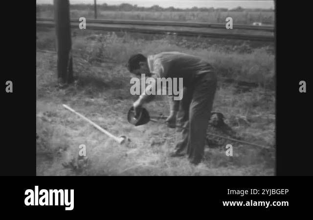 USA - 1950s - A demonstration of safety equipment for work on power ...