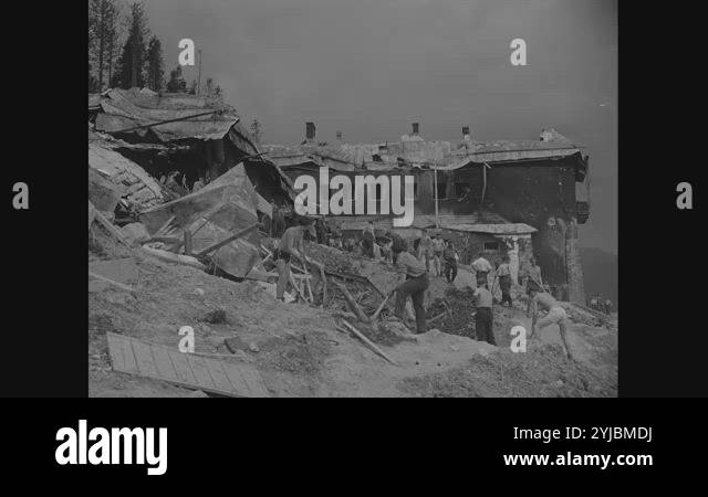 1945 - Nazi POWs are made to help American soldiers demolish Hitler's ...
