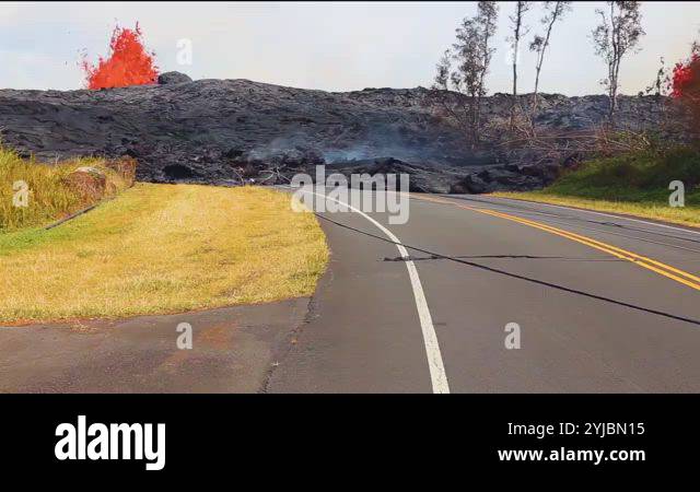 Lava flows across a road in Hawaii during the 2018 Kilauea volcano ...