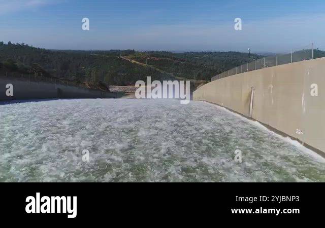 Spectacular aerial of water flowing through the restored new spillway ...