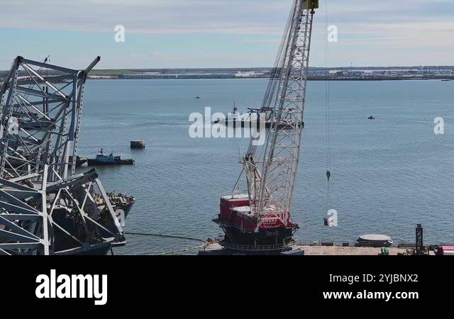 Baltimore, Maryland, 04/04/2024 Drone aerial of cranes off loading ...