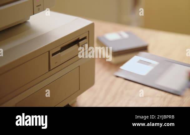 Hand inserting and ejecting Floppy Disk into Drive of vintage PC. Drive ...