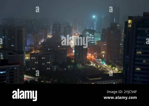 Shanghai's skyline at night features illuminated skyscrapers and ...