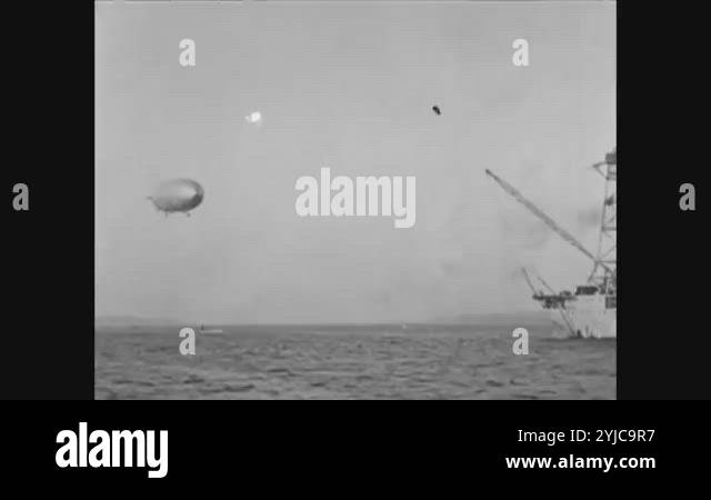 USA - 1924 - The USS Los Angeles dirigible approaches the USS Patoka ...