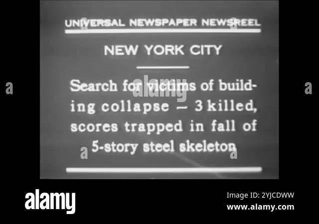 Black and white footage of a search for people trapped under a ...