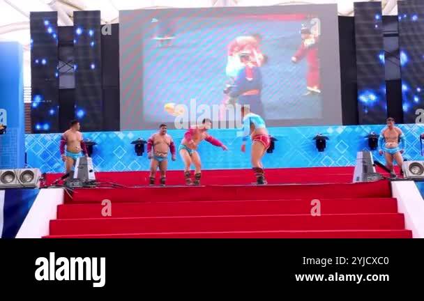 Chungju, South Korea - October 10, 2022: A Mongolian wrestling match on an open stage - two ...