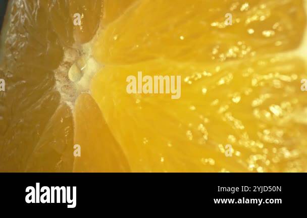 The macro photography of a sliced orange with vibrant orange color and ...