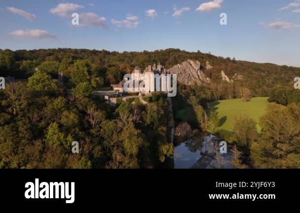 Discover the stunning architecture of Walzin Castle nestled in lush ...