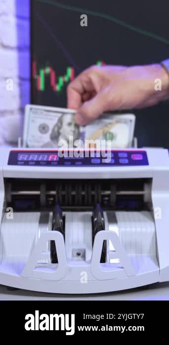 Modern counter machine on large monitor background. Man's hand putting ...