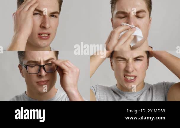 A young man shows signs of distress, touching his forehead, rubbing his ...