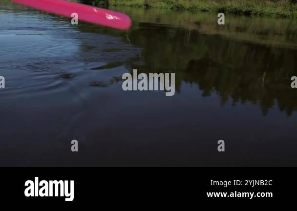 Red Oar Plunges into the Water of the River. Rowing. Oar Blade. An Oar ...