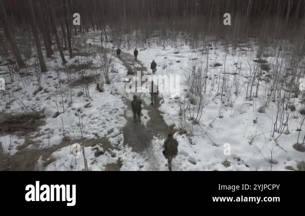 AERIAL VIEW: Group of fully equipped soldiers in camouflage uniform ...