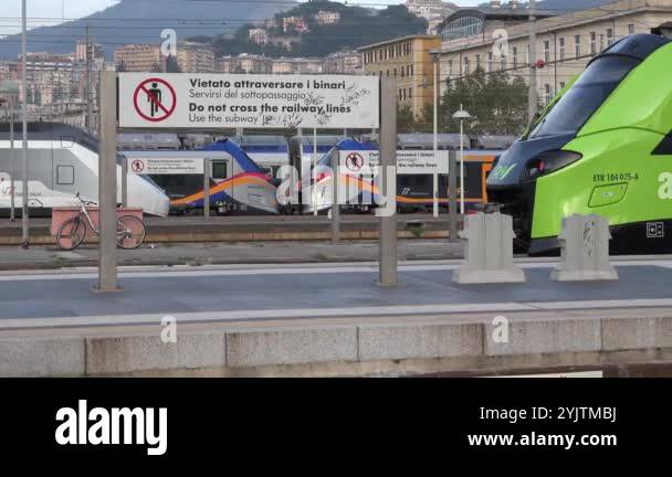 GENOA, ITALY, NOVEMBER 06 2024 - Do not cross the tracks - Use the ...