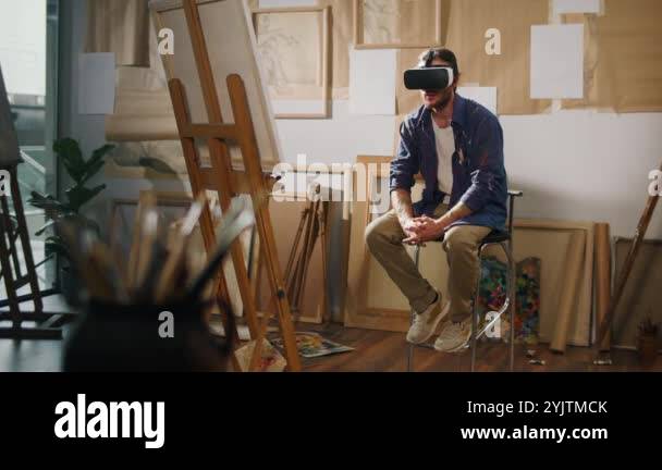 A Male Artist Uses VR Glasses to Create Unique Art in His Bright Studio ...