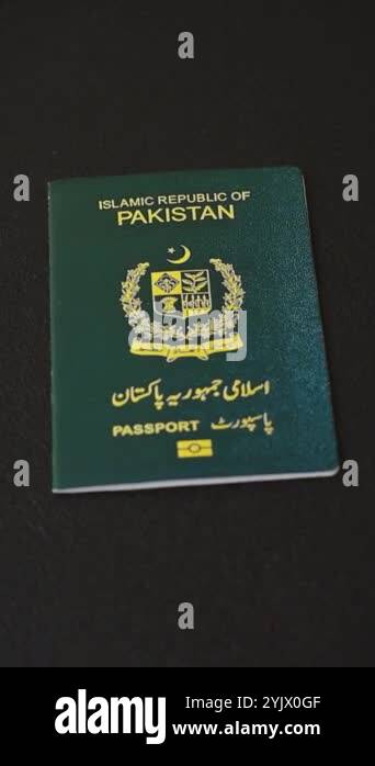 Physical paper international passport of Pakistani citizen on dark ...