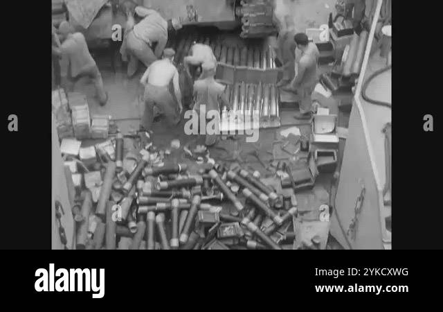 SOUTH KOREA - 1950 - US soldiers stack shells and move along ship ...