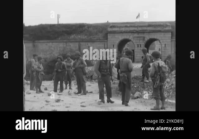 CHERBOURG - 1944 - US soldiers walk around the grounds of the Fort of ...