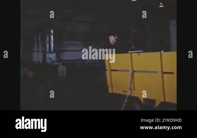 US - 1971 - in this silent home movie, military men are unloading boxes ...