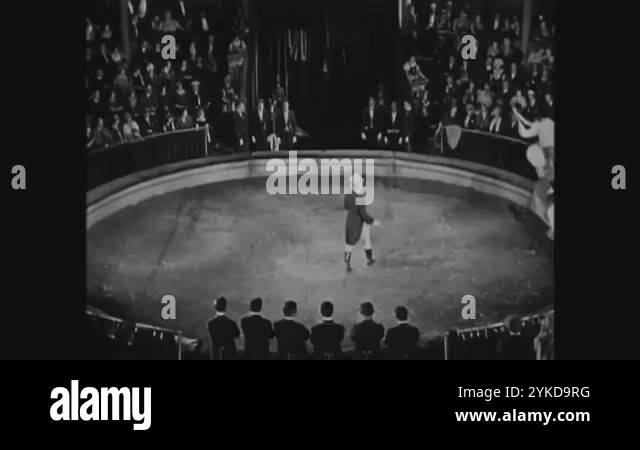 US - 1924 - in this silent comedy, two acrobats are standing on a circus horse circling the ...