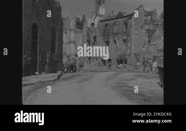 FRANCE - 1944 - US cameramen take photos of ravaged town in Courterne ...