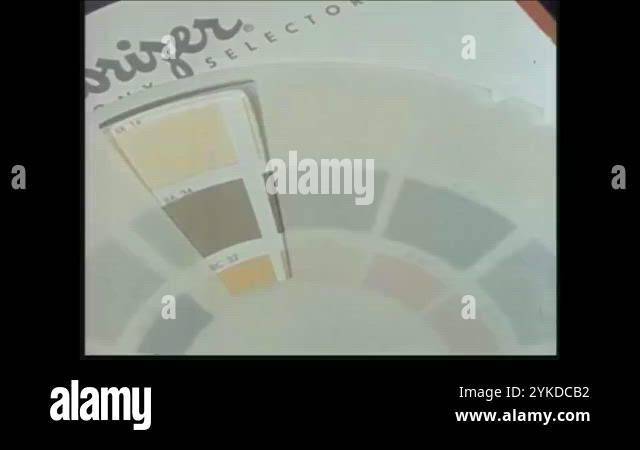 USA - 1950s - A woman shows how to use a Colorizer paint chip selector ...