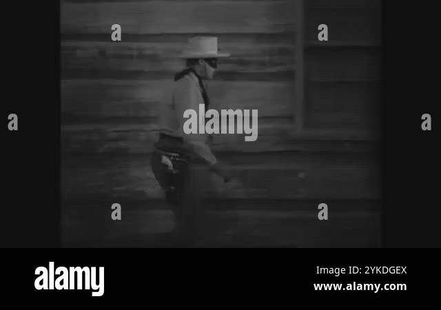 US - 1949 - in this western, a cowboy throws a bag of money to an ...