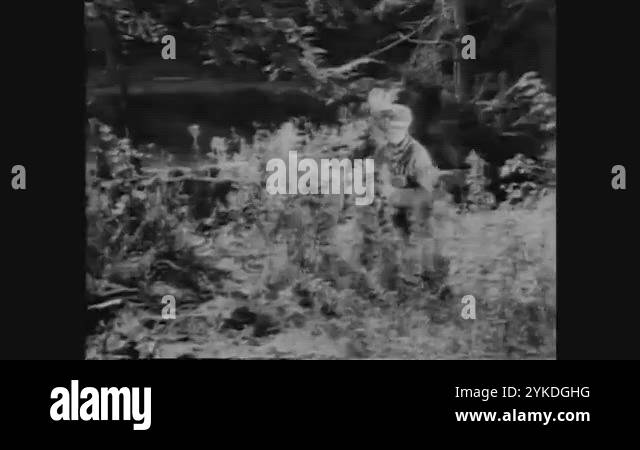 US - 1957 - in this western, a trapper and a Native American see thick ...