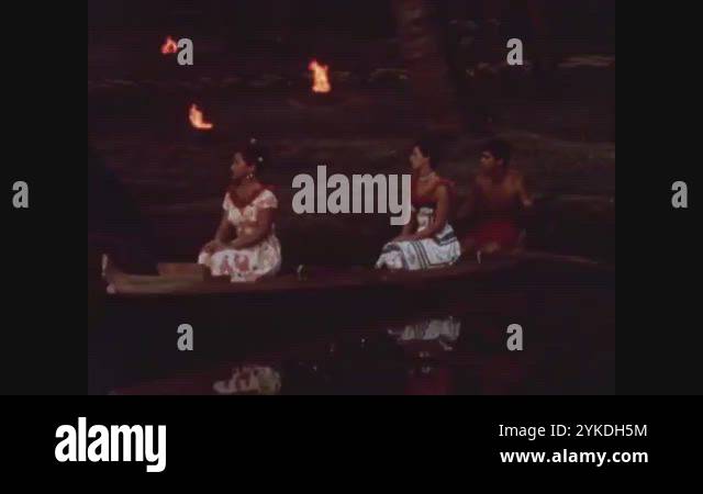 KAUAI - 1950s - Polynesian performers sing and play guitar for tourists ...