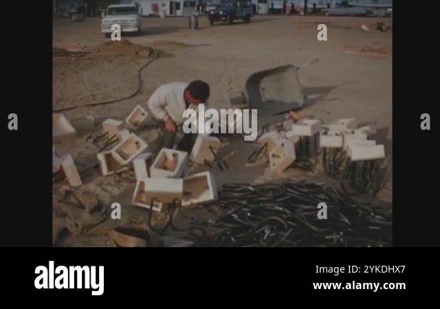 CALIFORNIA - 1960s - A carpenter works on the construction site of the Ronald Moran Cadillac ...